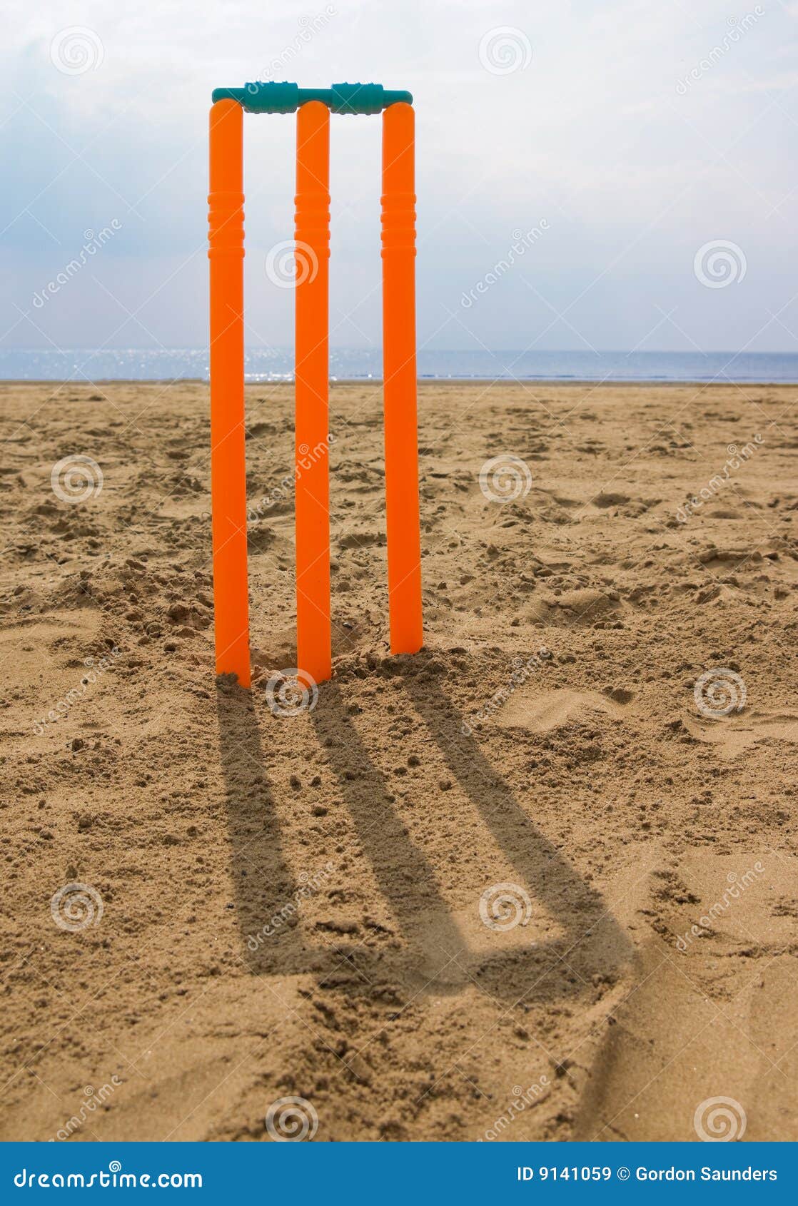 Cricket stumps on beach stock image. Image of beach, orange - 9141059