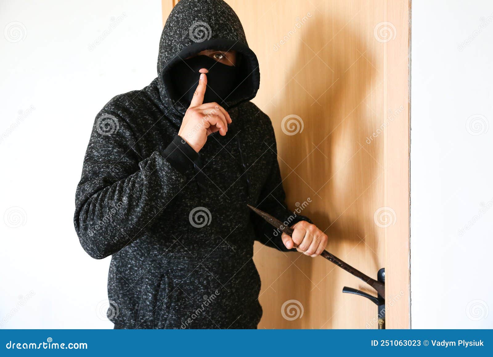 Criminal with Crowbar Near the Doors. Robber Breaking into House Stock ...