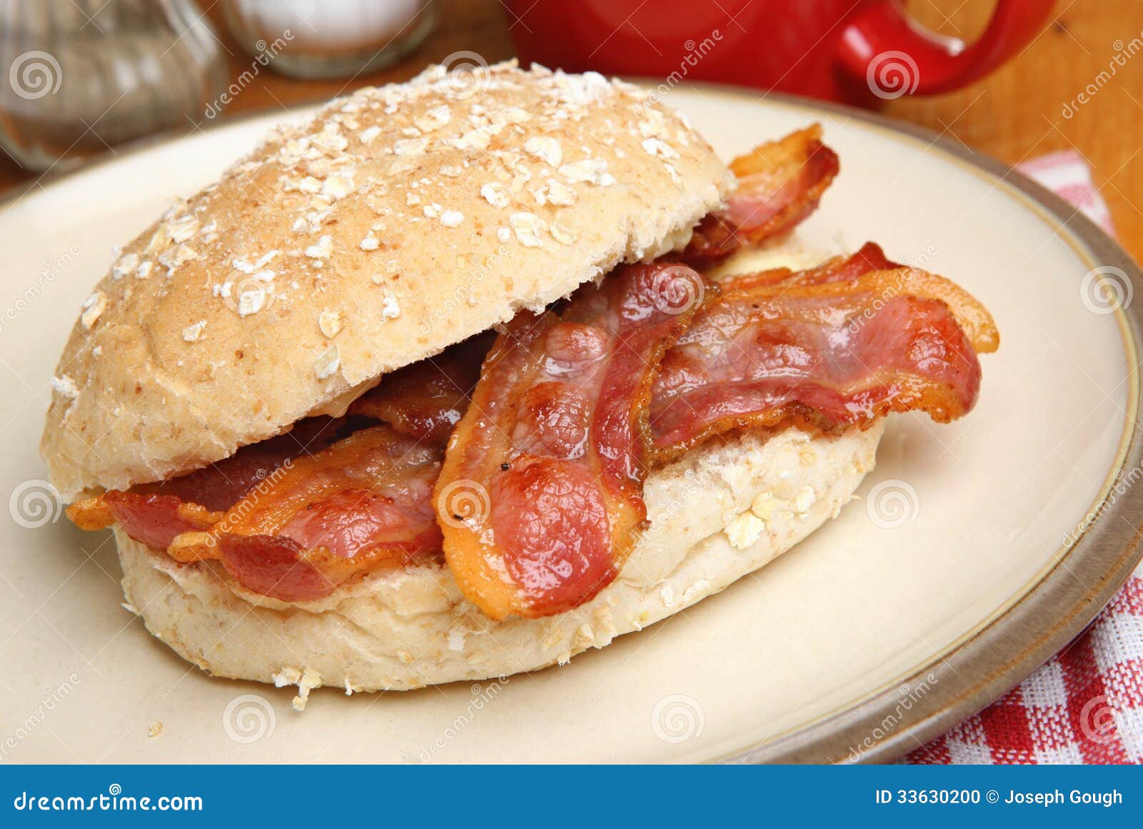 Crispy Bacon Roll or Bap stock photo. Image of wholemeal - 33630200
