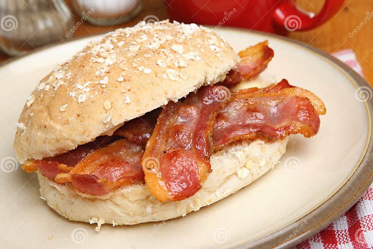 Crispy Bacon Roll or Bap stock photo. Image of wholemeal - 33630200