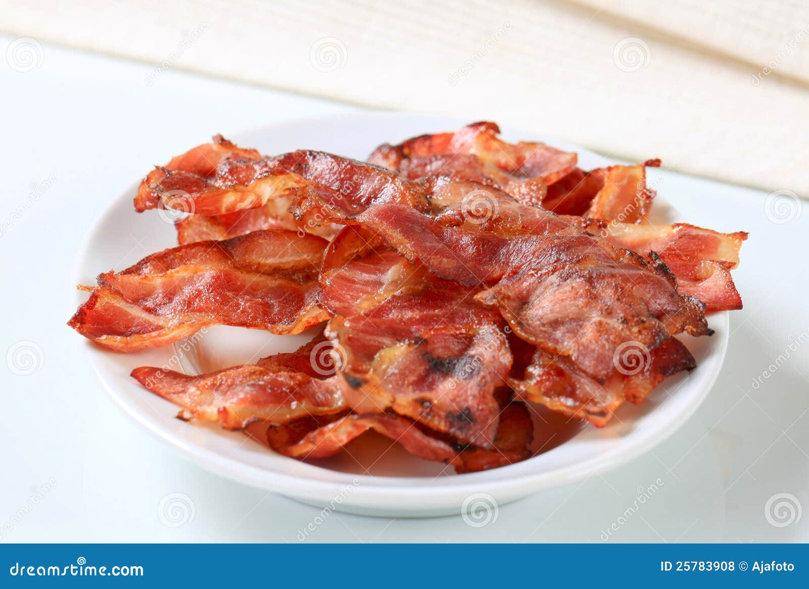 Crispy bacon strips stock photo. Image of closeup, white - 25783908
