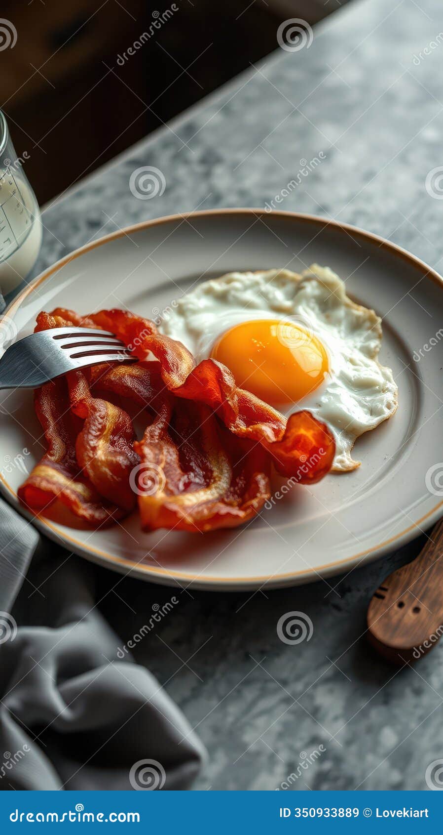 Crispy Bacon and Sunny-side-up Egg Served on a Plate with a Rustic ...