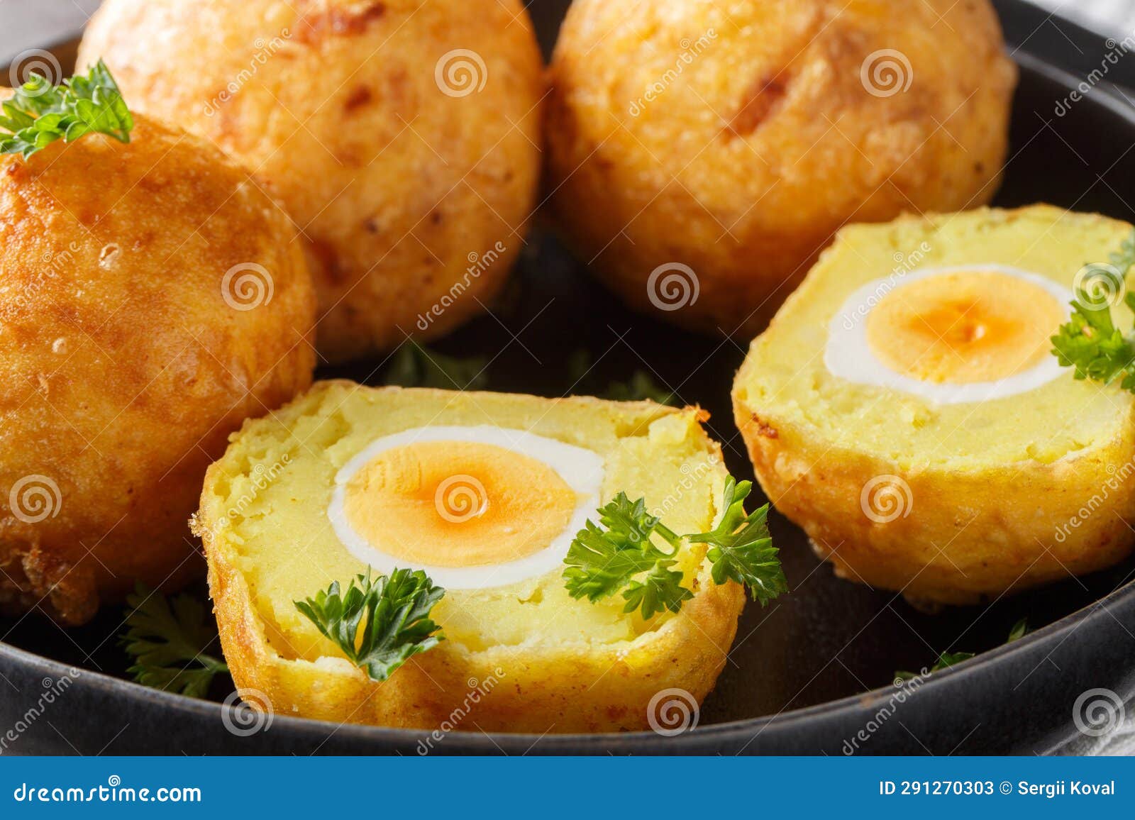 Crispy Balls of Cassava Puree with Eggs, Deep Fried Close-up in a Plate ...