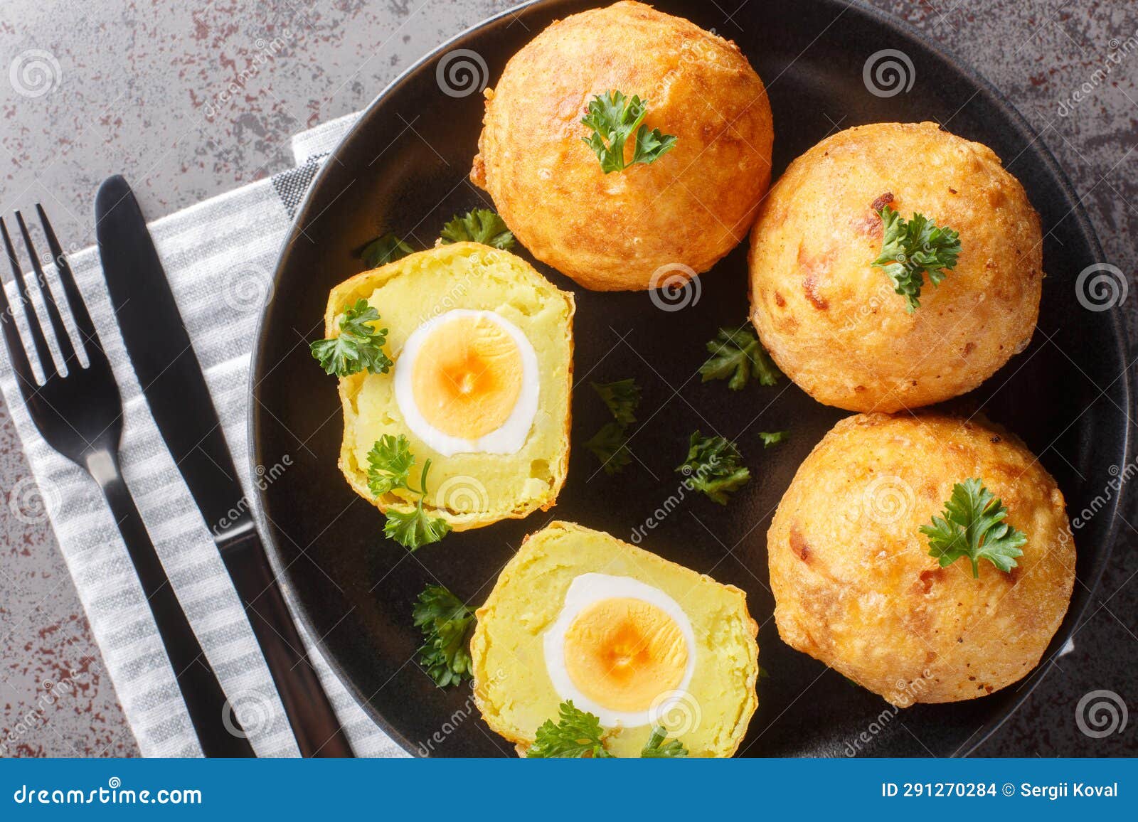 Crispy Balls of Cassava Puree with Eggs, Deep Fried Close-up in a Plate ...