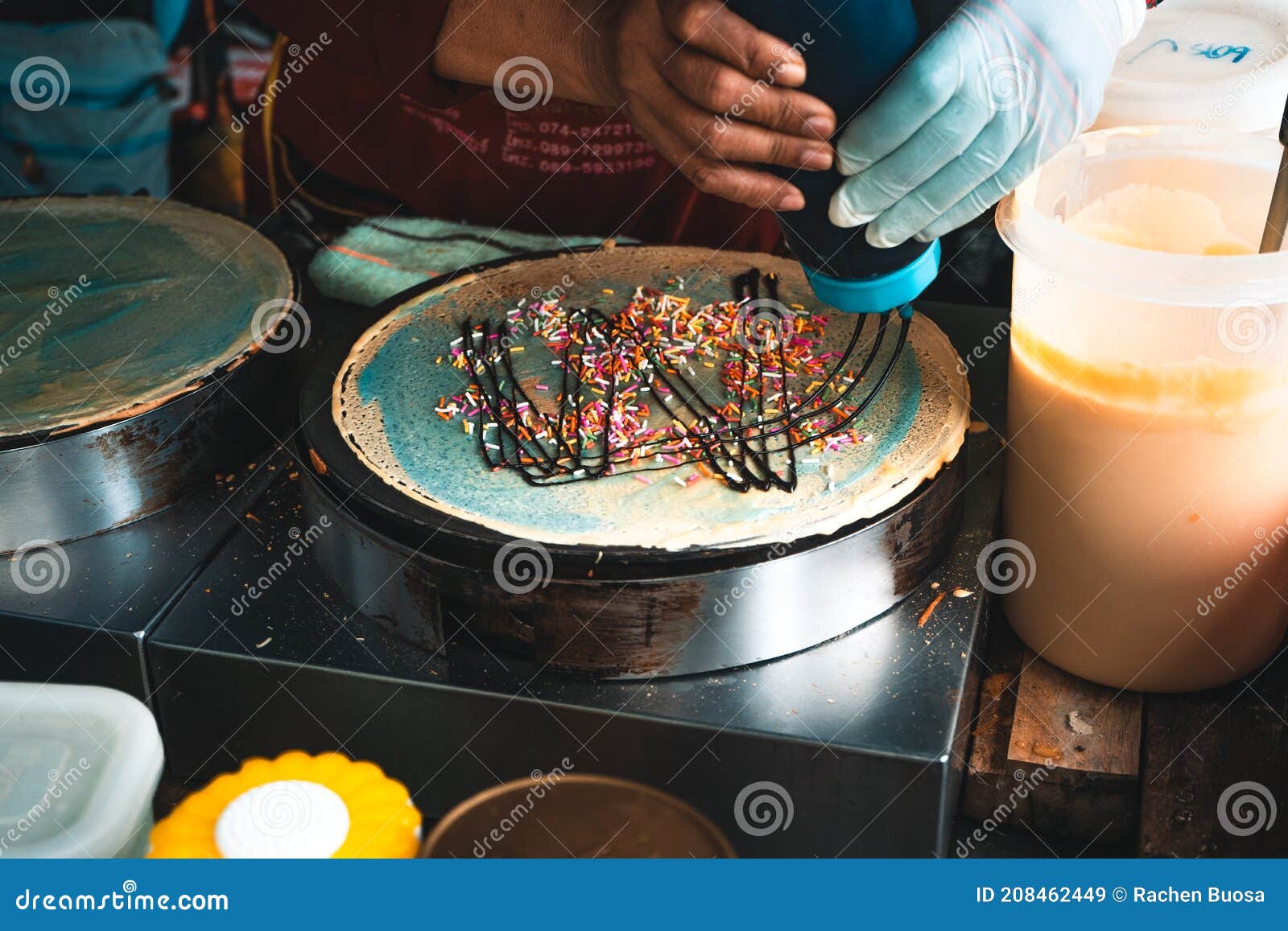 Crispy Crepes are Being Made in the Market.Making Dessert Stock Image ...