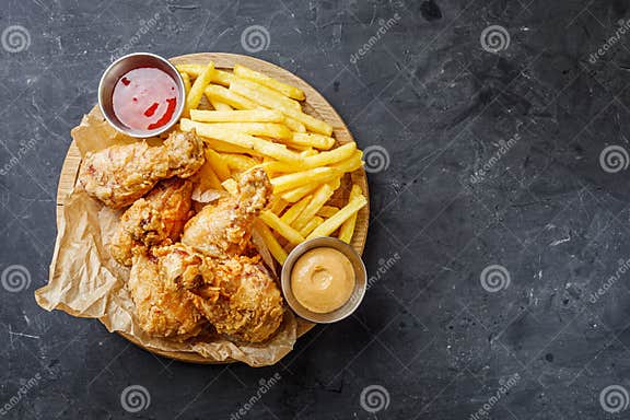 Crispy Deep-fried Chicken Drumsticks on a Black Background Stock Photo ...