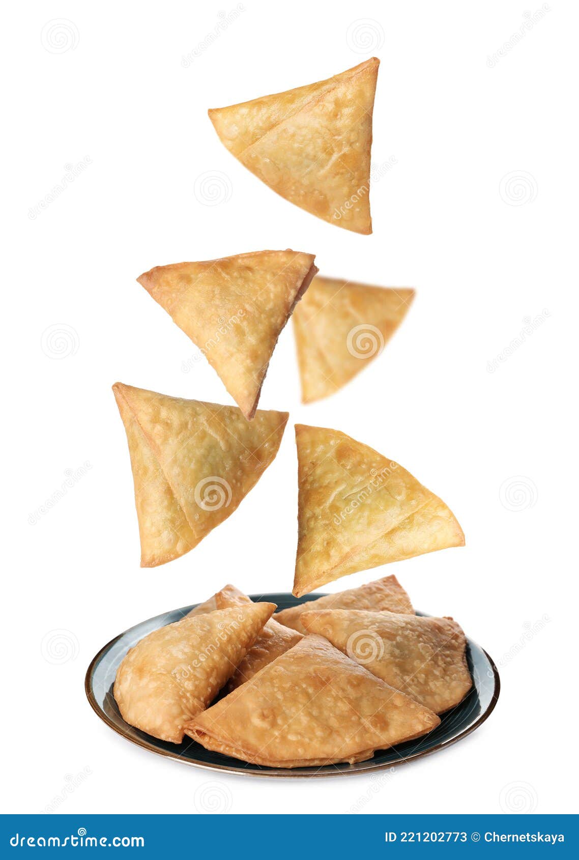 Crispy Delicious Samosas Falling into Plate on White Background Stock ...