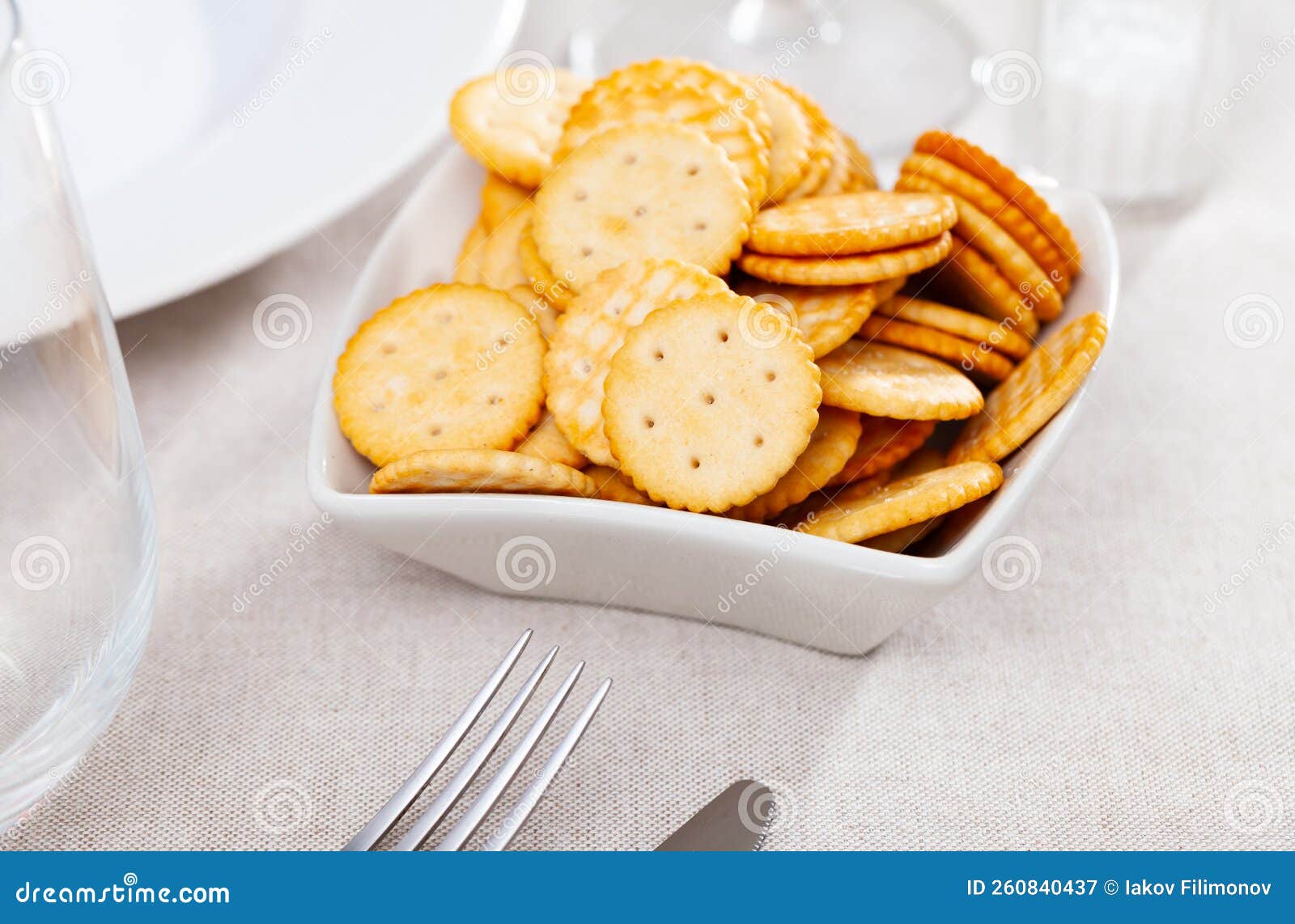 Crispy Disc-shaped Lightly Salted Crackers in Plate on Table Stock ...
