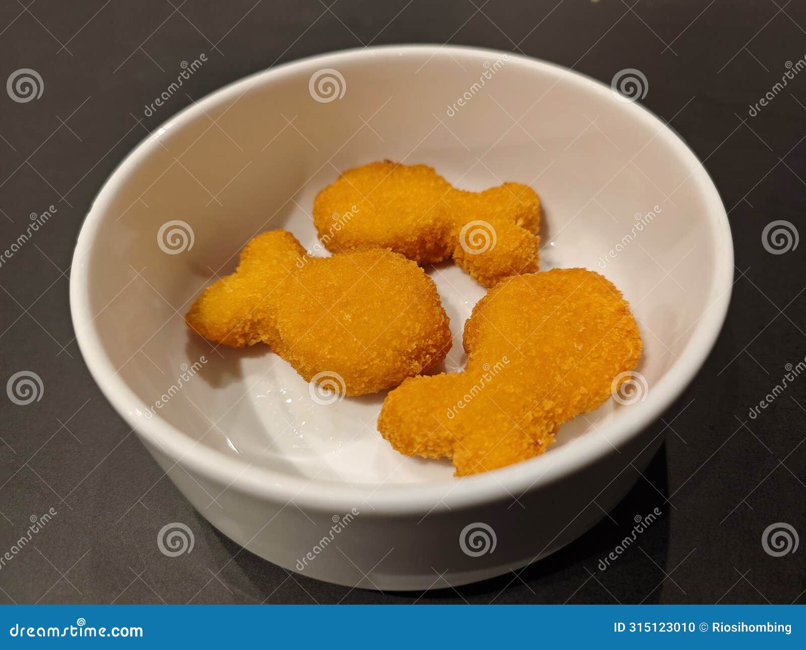Crispy Fish Shaped Chicken Nuggets for the Kids Menu Stock Photo ...
