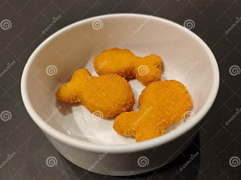 Crispy Fish Shaped Chicken Nuggets for the Kids Menu Stock Photo ...
