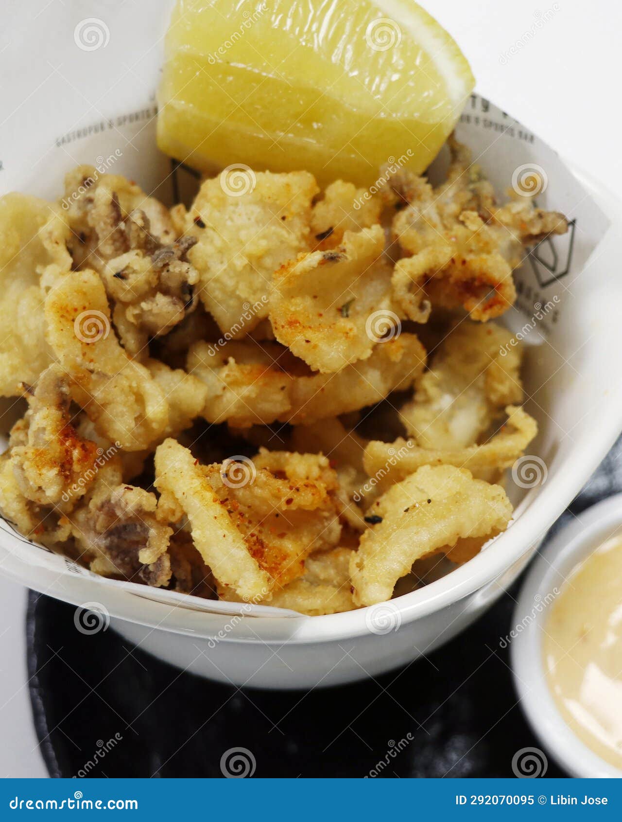 Crispy Fried Calamari ( Squid )with Lemon Stock Image - Image of coated ...