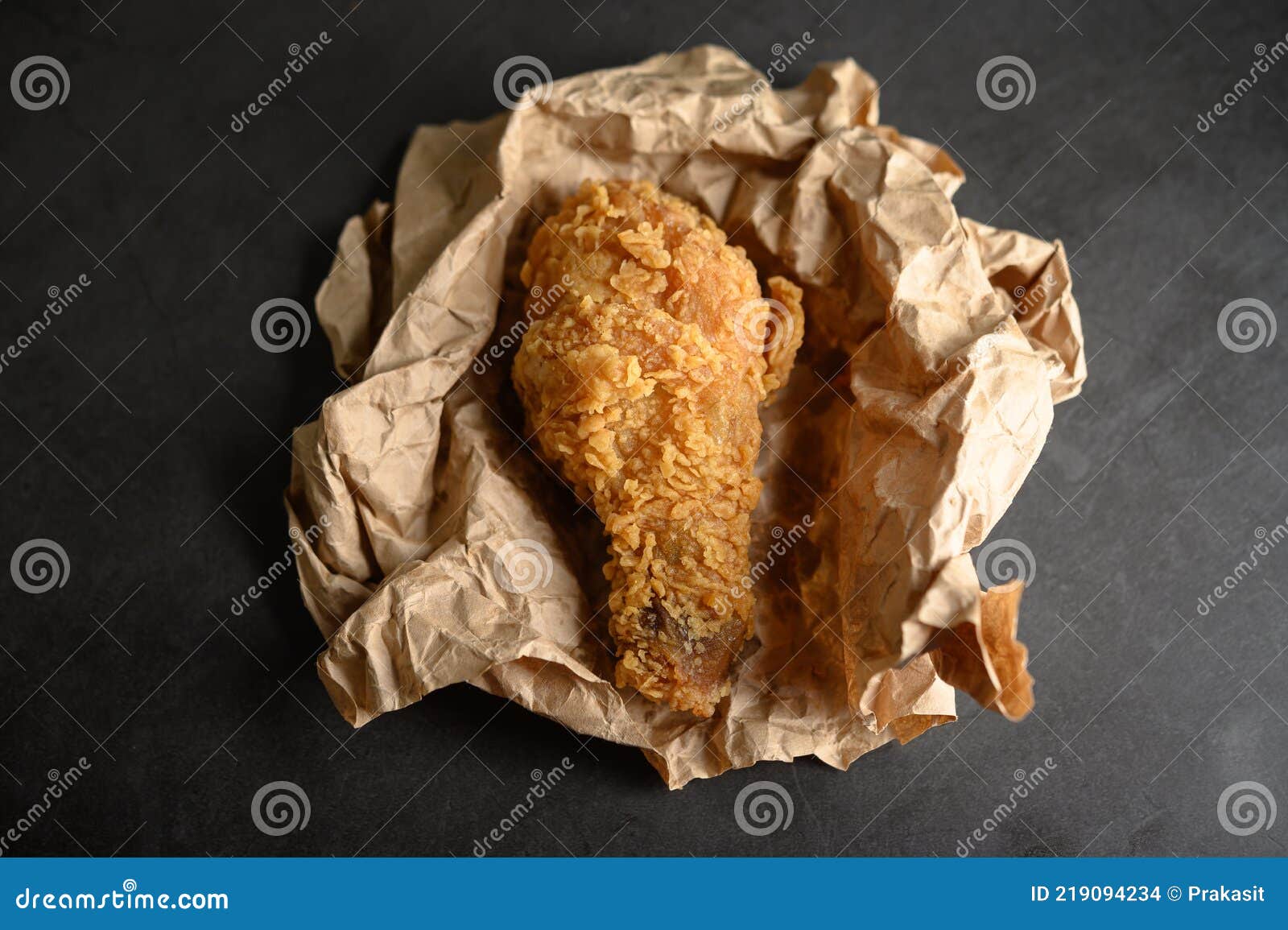 Crispy Fried Chicken on a Brown Paper Stock Photo - Image of closeup ...