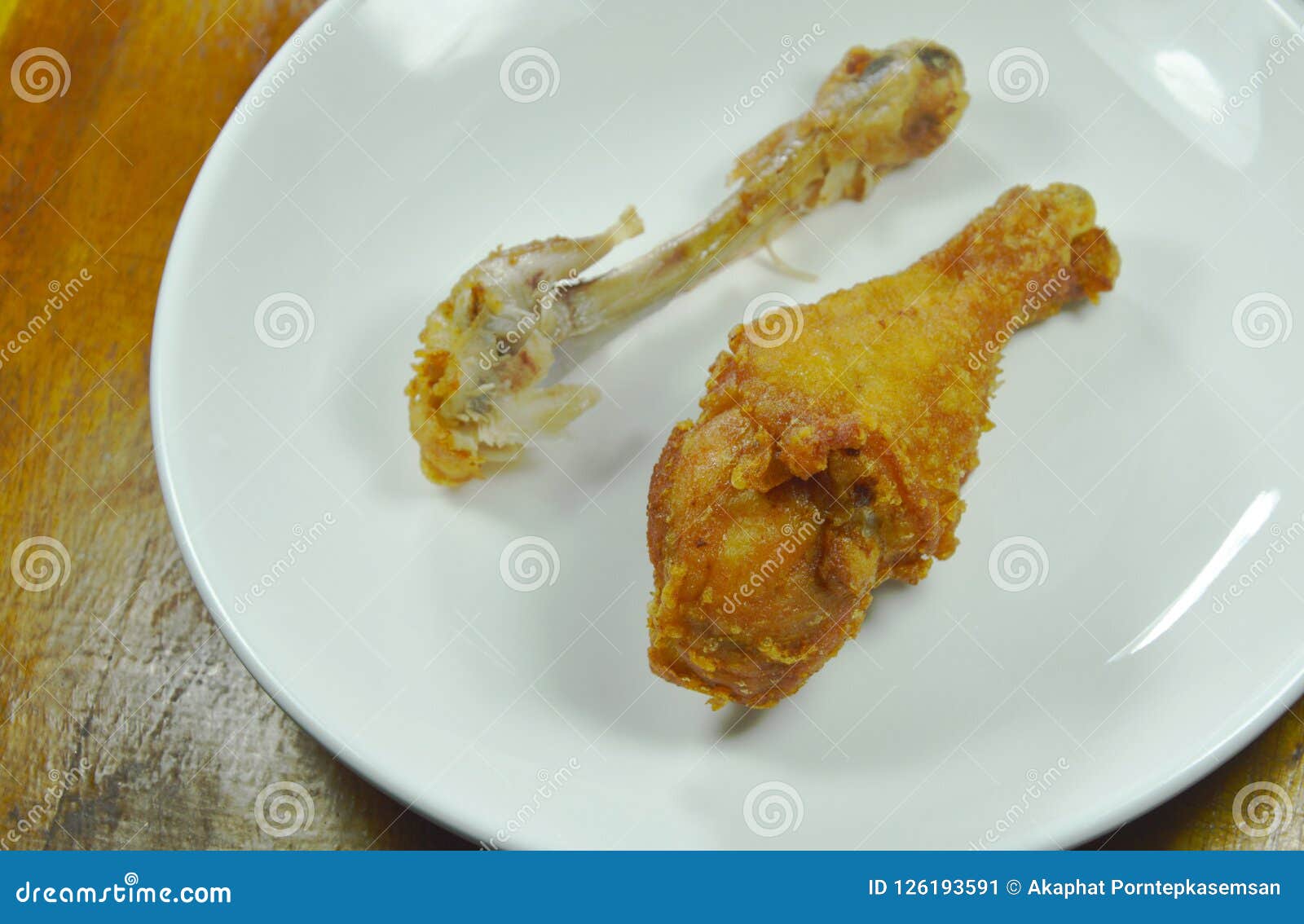 Crispy Fried Chicken Leg and Bone on Plate Stock Image - Image of ...