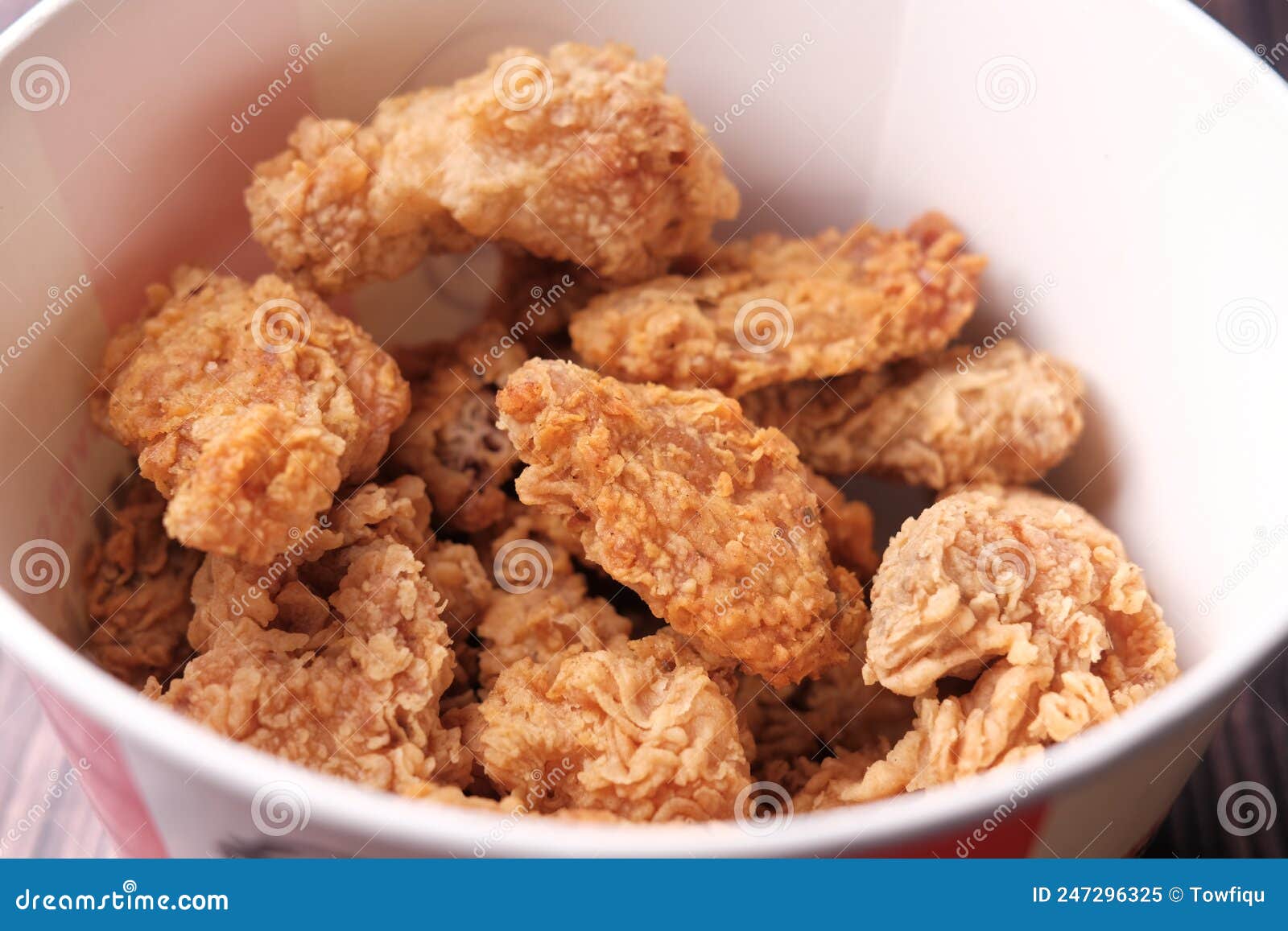 Crispy Fried Chicken Wings in a Paper Packet on Table Stock Image ...