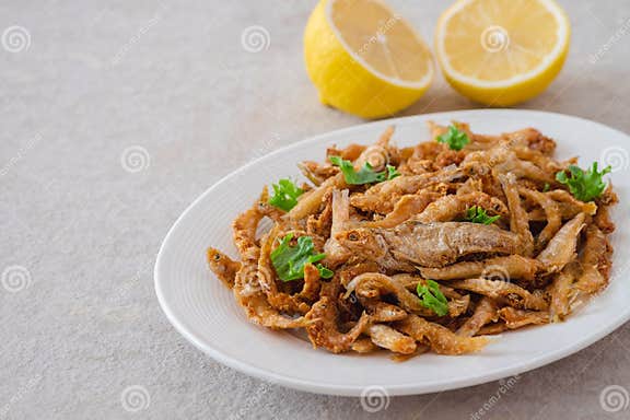 Crispy Fried Small Fish on White Plate Stock Image - Image of plate ...