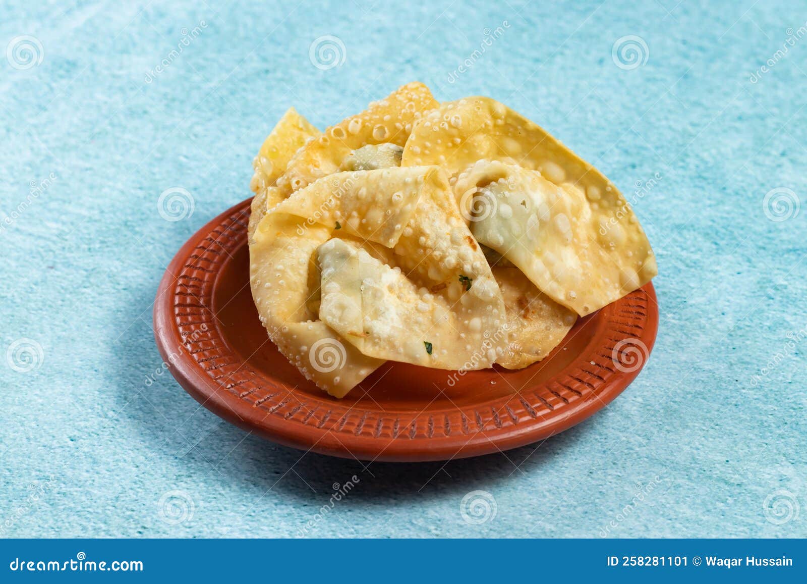 Crispy Fried Wonthon Dim Sum Wraps with Tomato Sauce Served in a Dish ...