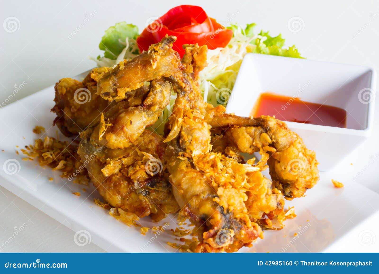 Crispy frog legs stock photo. Image of tomatoes, gourmet - 42985160