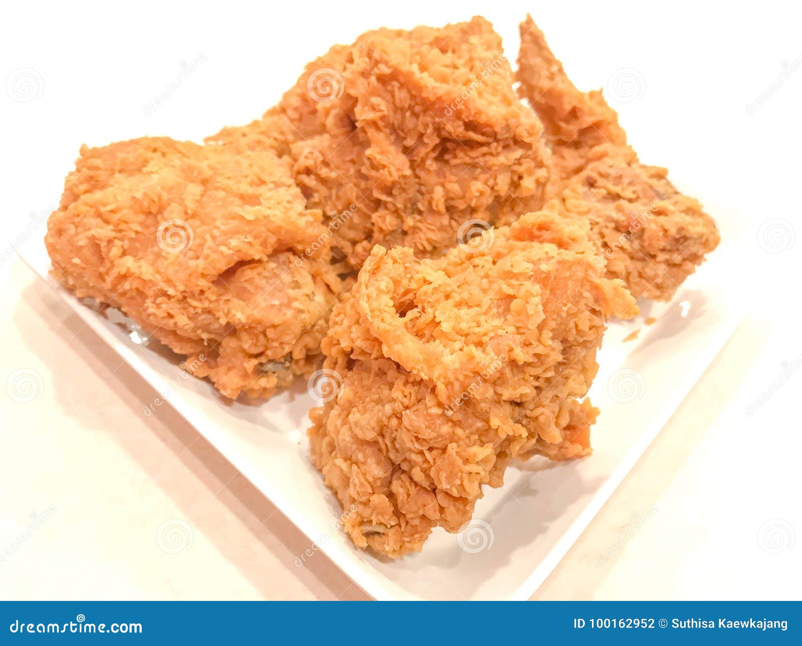 Crispy Kentucky Fried Chicken on a White Plate and Table. Stock Photo ...
