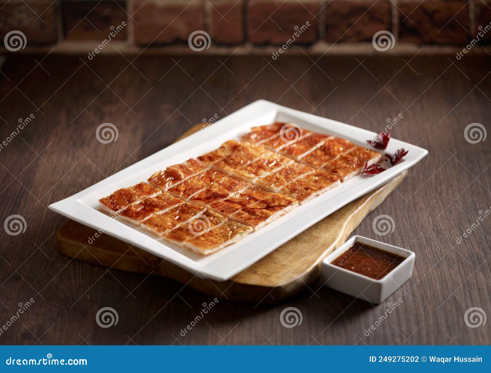 Crispy Phoenix Chicken with Sauce Served in a Dish Side View on Dark ...