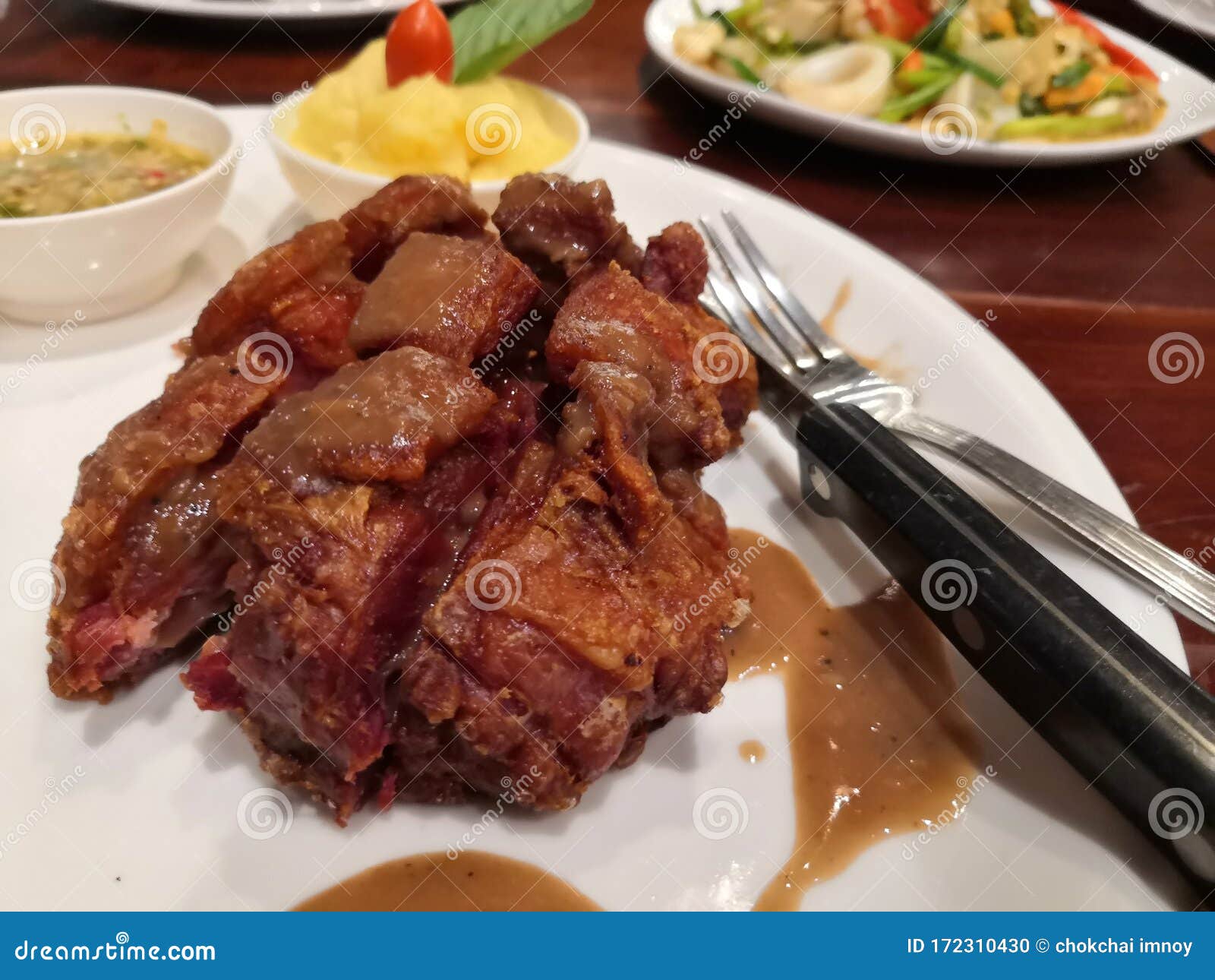 Crispy Pork on a Plate on the Table Stock Photo - Image of pork, crispy ...