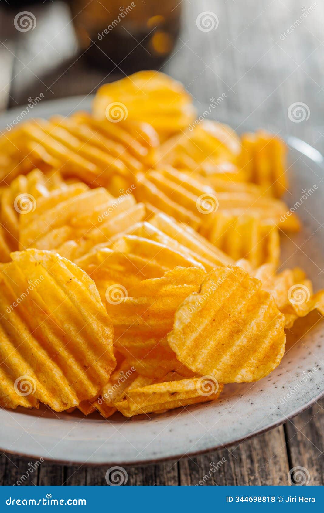 Crispy Potato Chips on Plate on Wooden Table Stock Photo - Image of ...