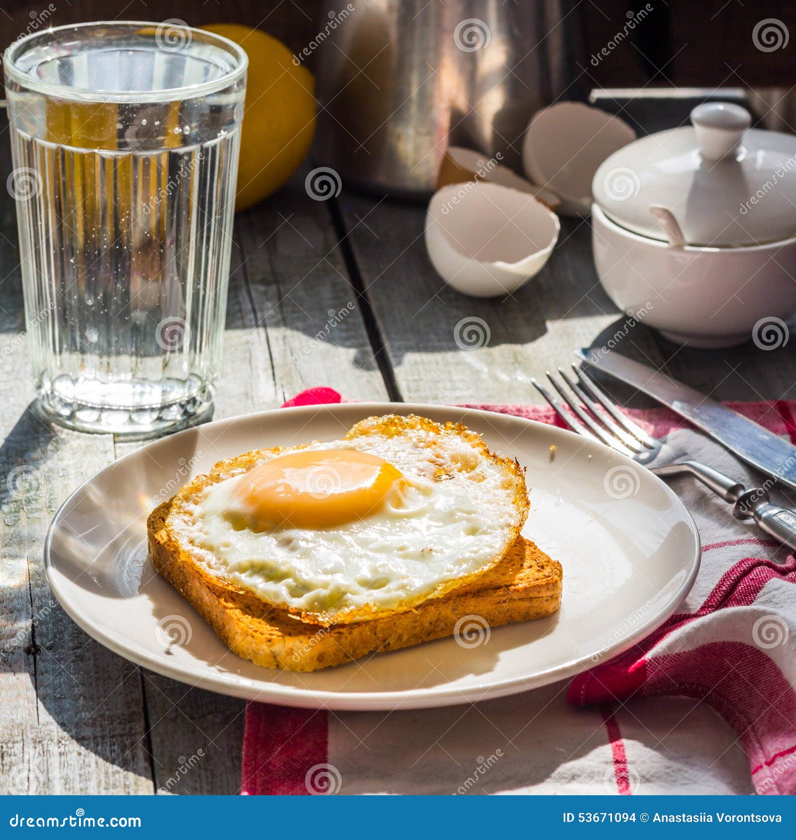 Crispy Toast with a Fried Egg and a Glass of Water, Lemon, Break Stock ...