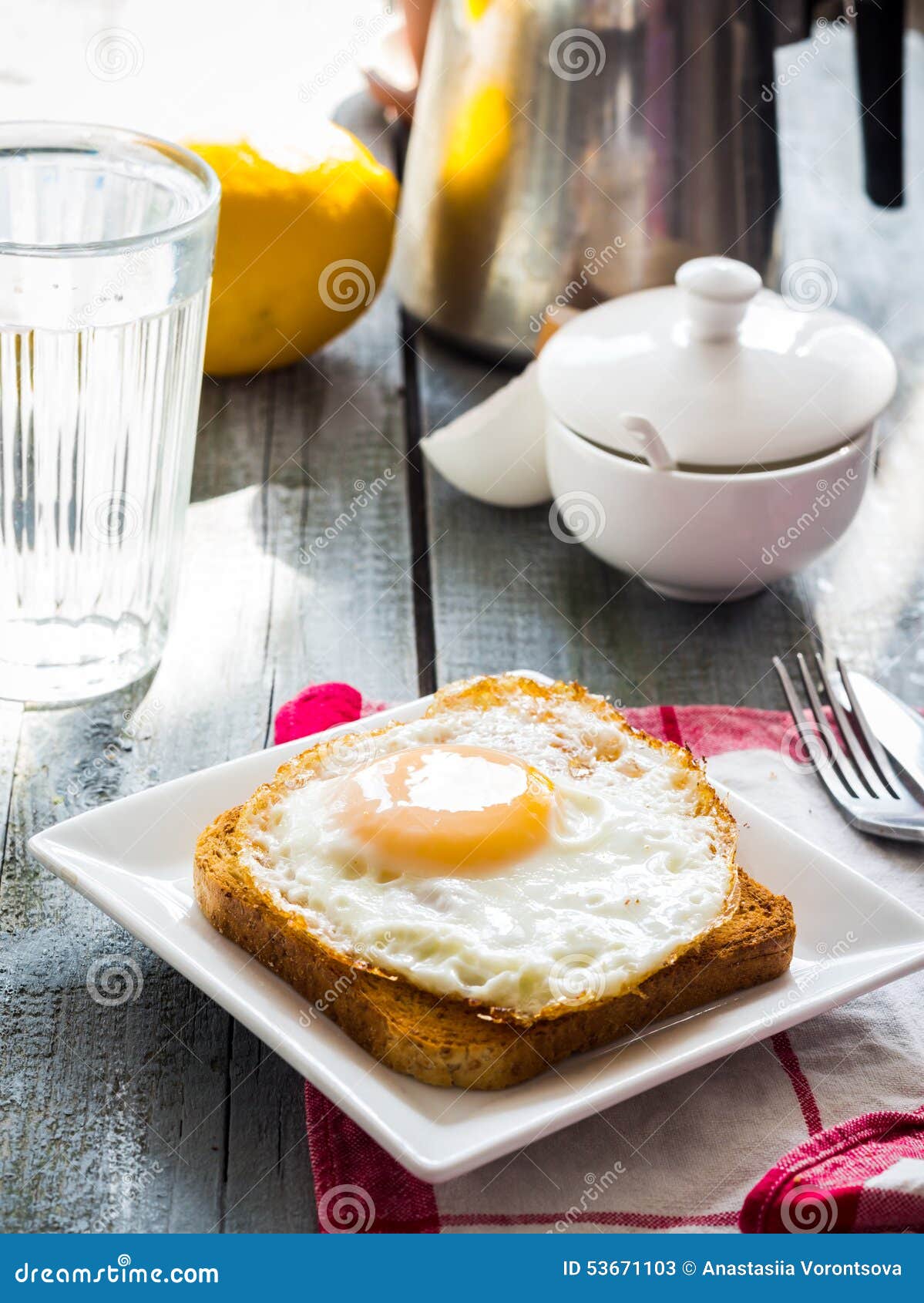 Crispy Toast with a Fried Egg and a Glass of Water, Lemon, Break Stock ...