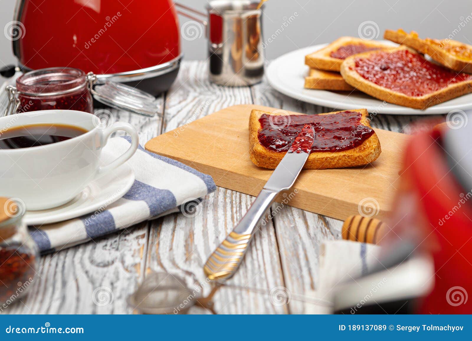 Crispy Toasts Covered with Fruit Jam Served on Kitchen Table Stock ...