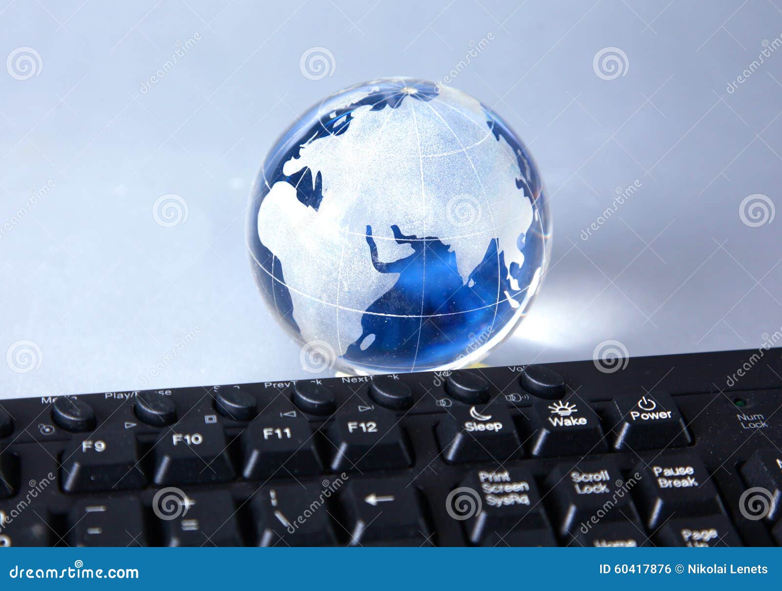 Cristal Globe of the Earth on a Computer Stock Photo - Image of ...