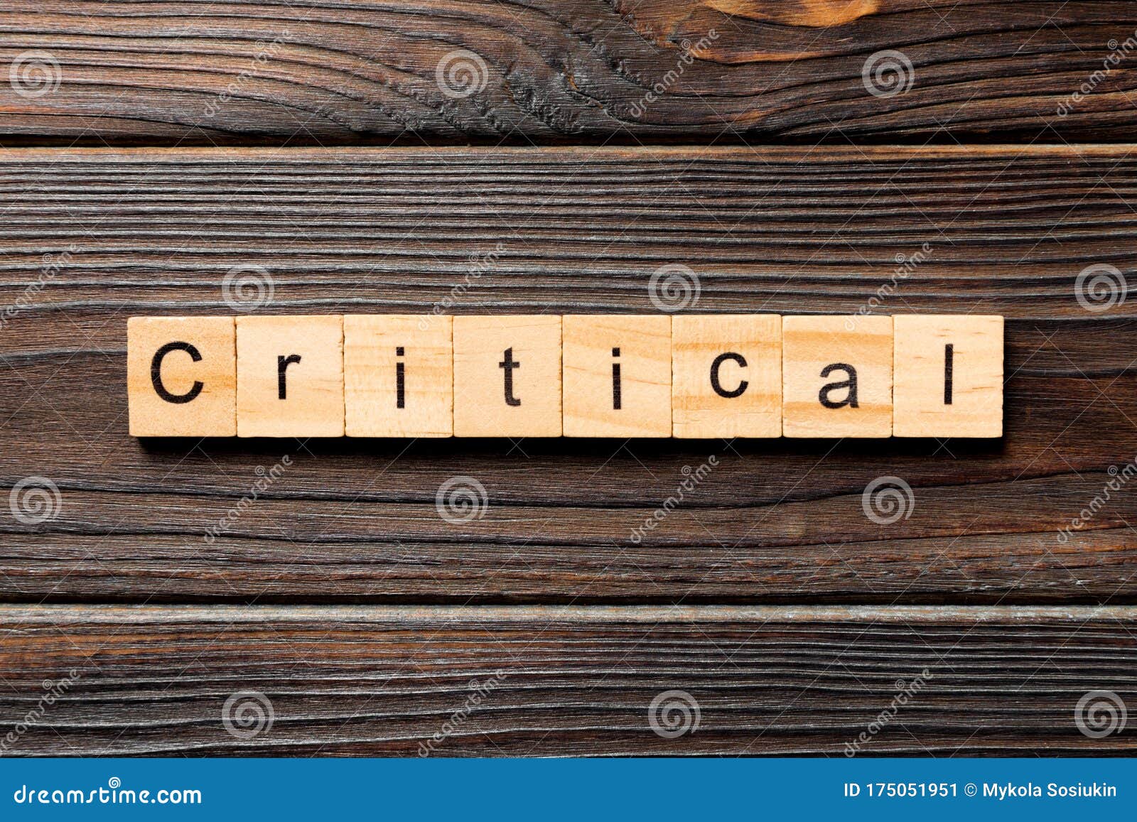 Critical Word Written on Wood Block. Critical Text on Table, Concept ...