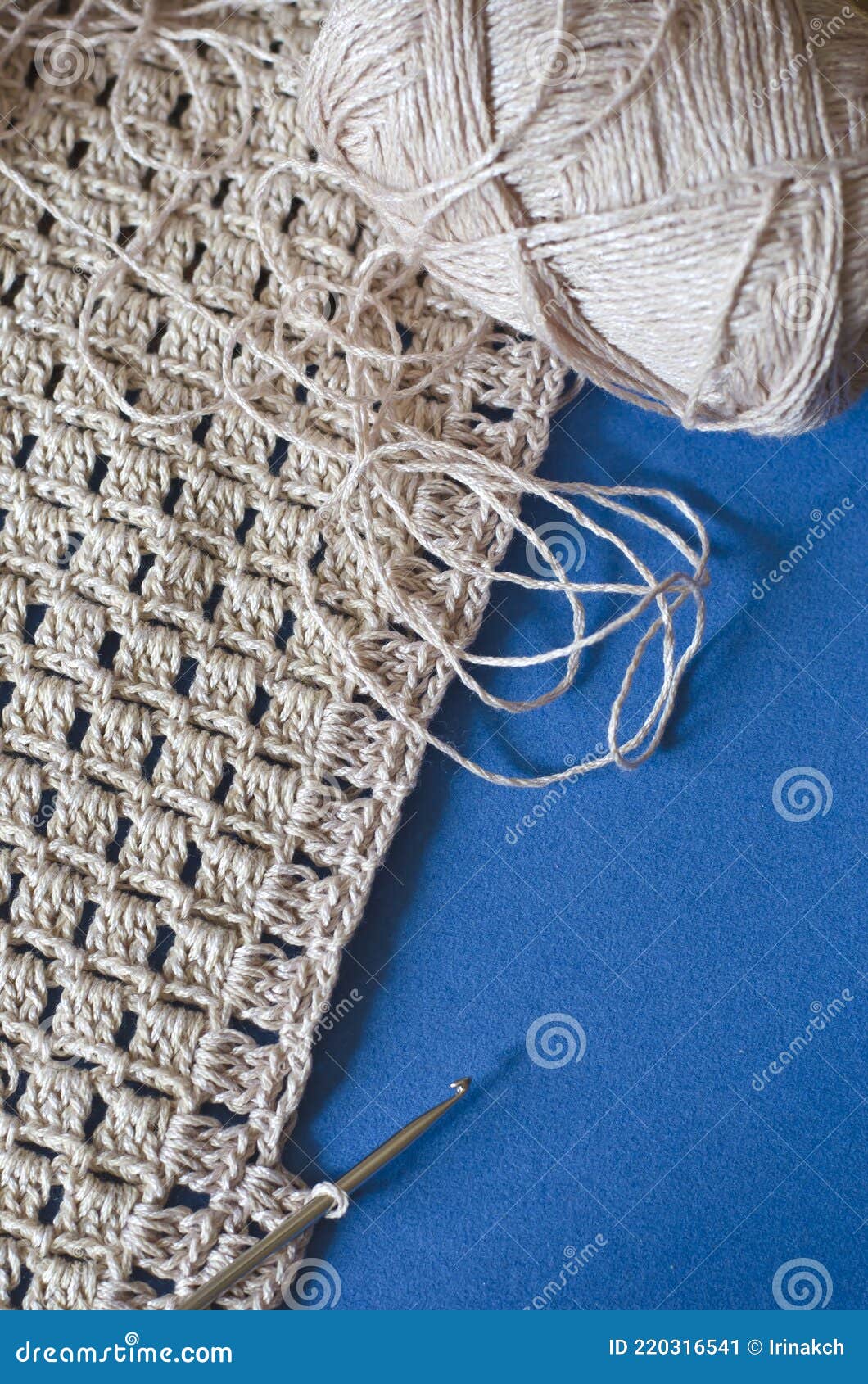 Crochet with Beige Cotton Threads on a Blue Background Stock Image ...