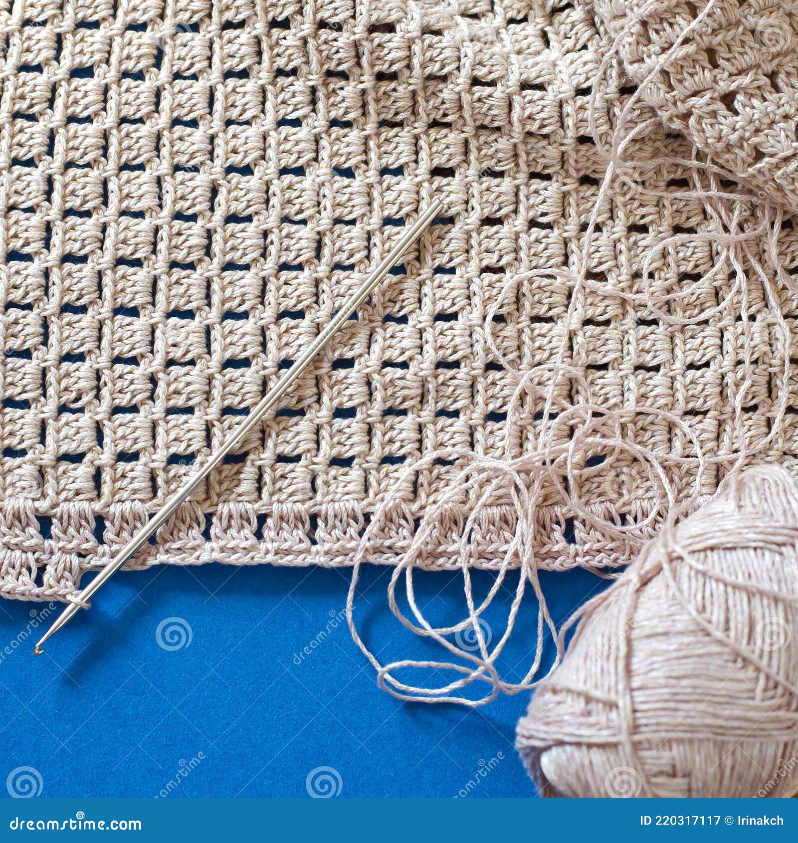 Crochet with Beige Cotton Threads on a Blue Background Stock Image ...