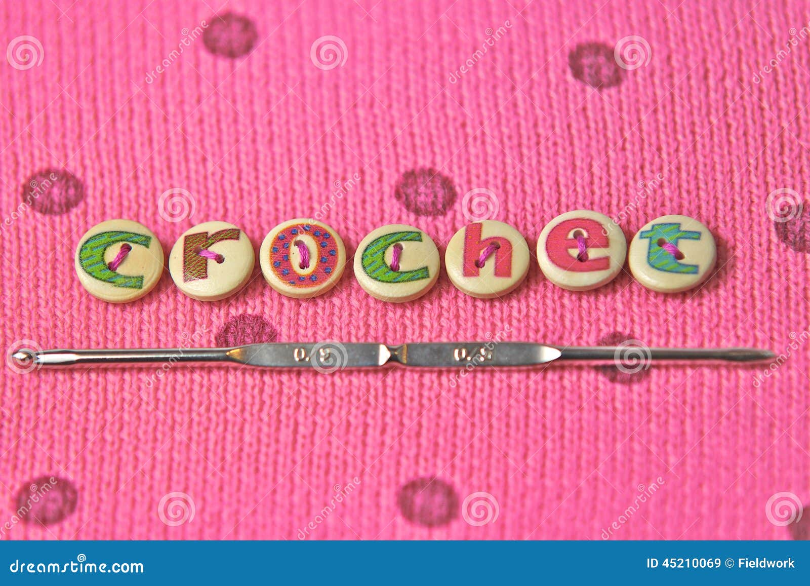 Crochet Spelled in Lettered Buttons on a Pink Wool Background Stock ...