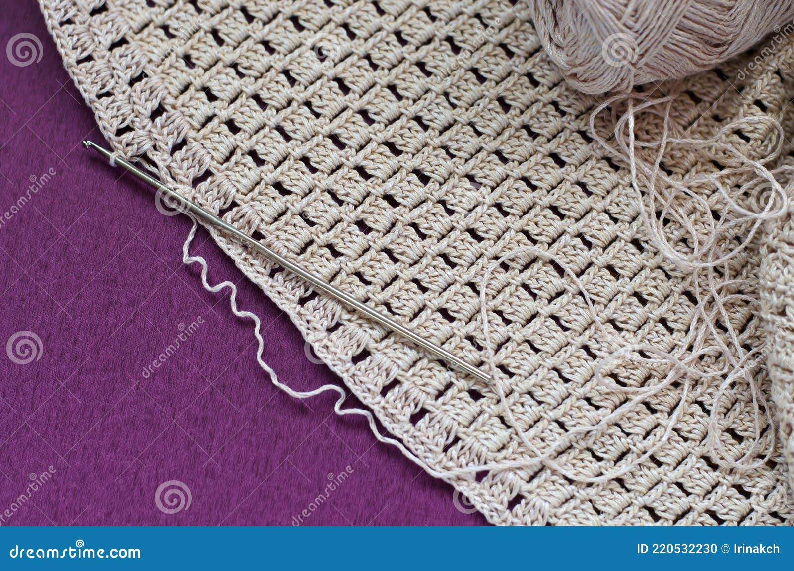 Crocheting with Beige Cotton Threads on a Purple Background Stock Photo ...