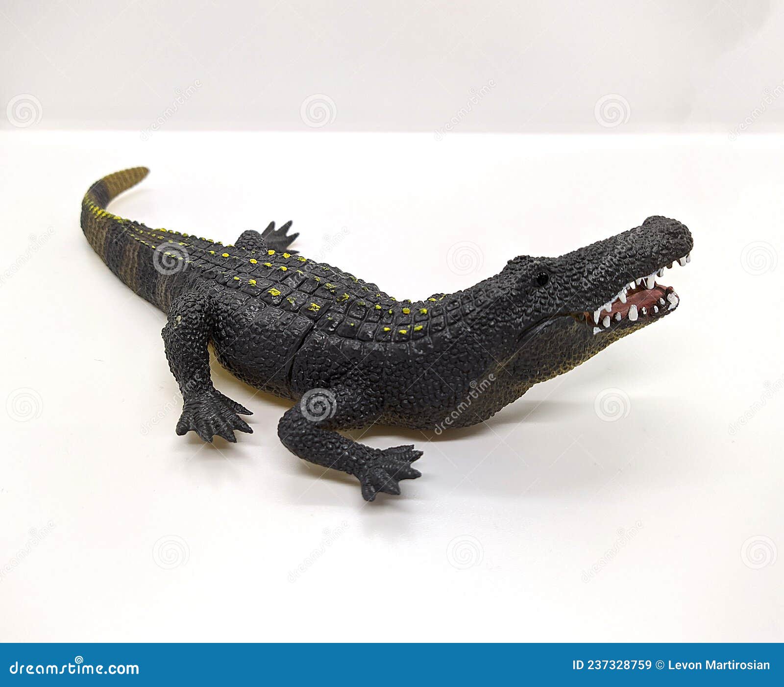 Crocodile Toy Made of Plastic on a White Background. Stock Image ...
