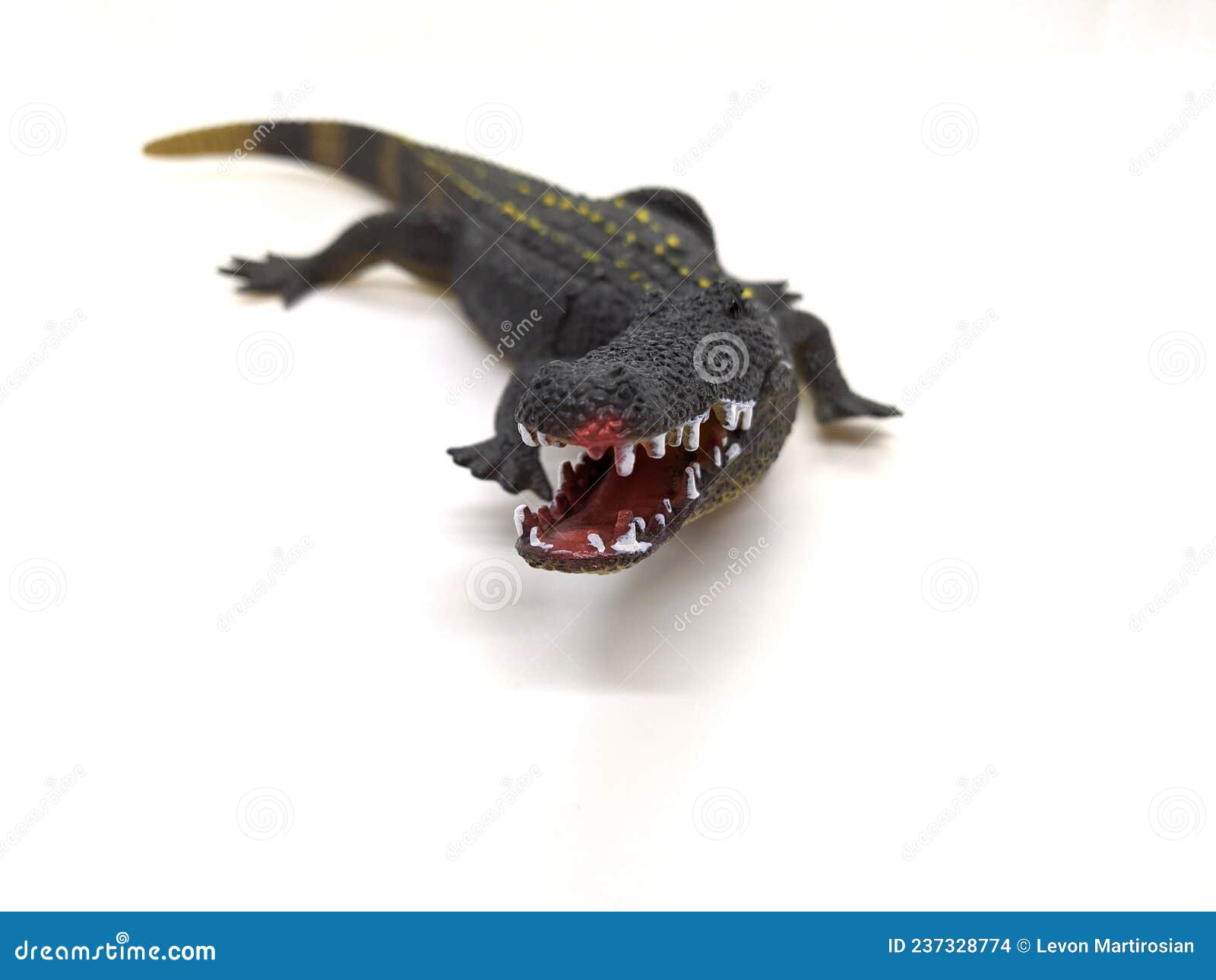 Crocodile Toy Made of Plastic on a White Background. Stock Photo ...