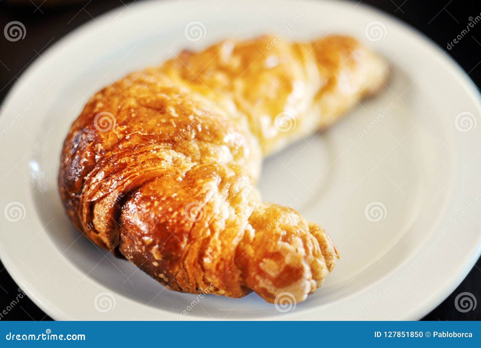 Croissant on plate stock photo. Image of delicious, tasty - 127851850