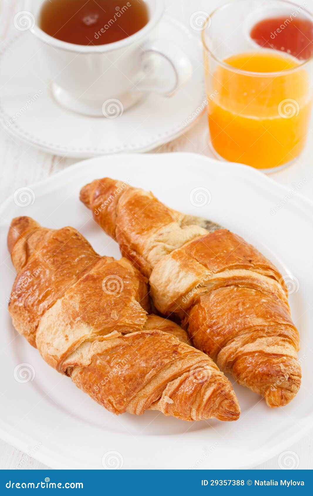 Croissant with tea, juice stock photo. Image of food - 29357388