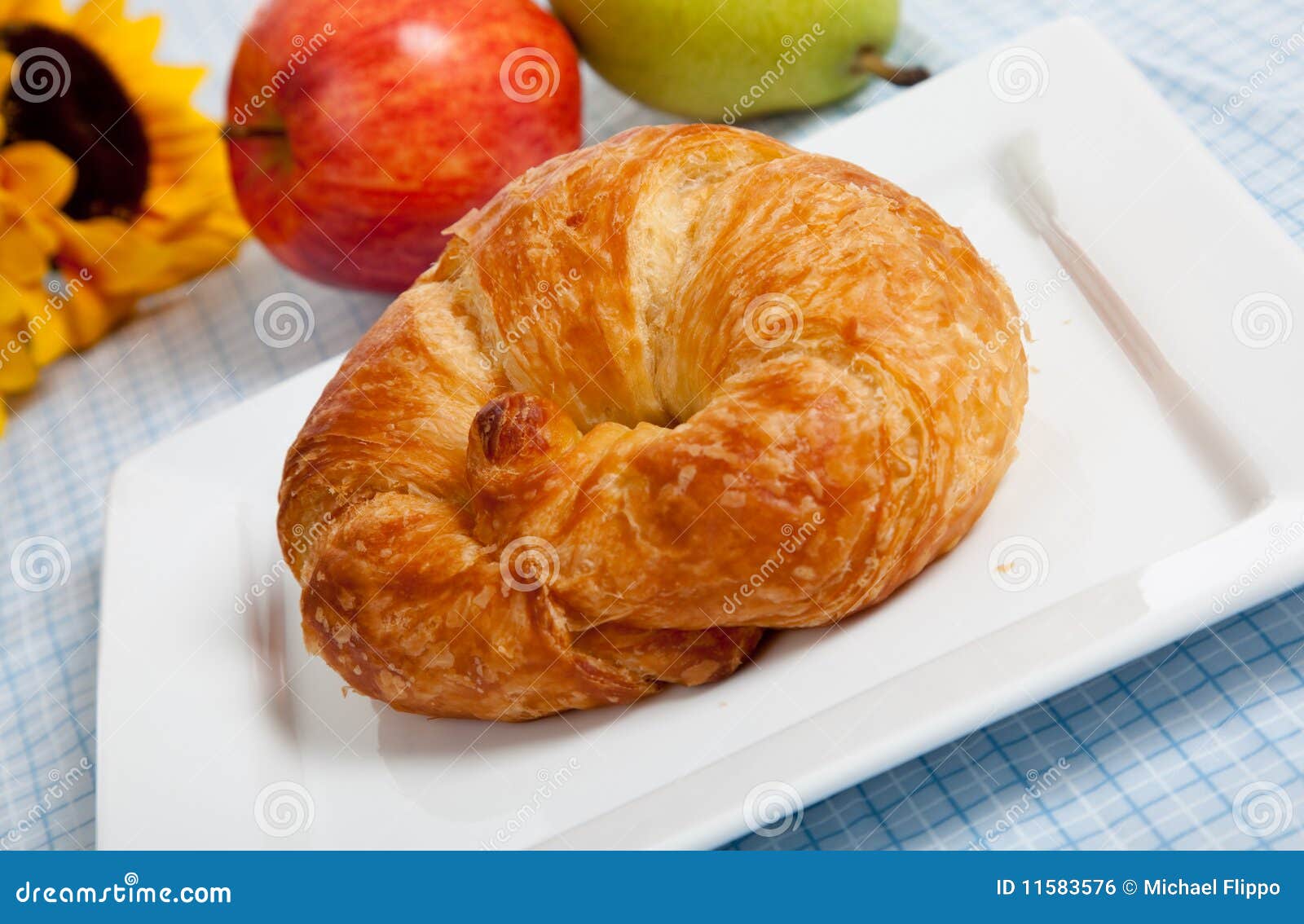 A Croissant on a White Plate with Apples Stock Photo - Image of ...