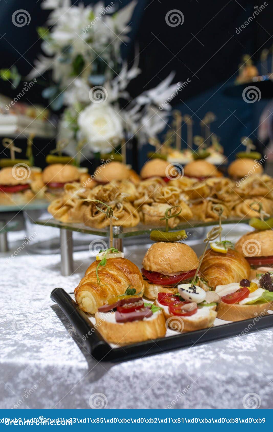 Croissants, Burgers and Various Snacks on Stands on the Buffet Table ...