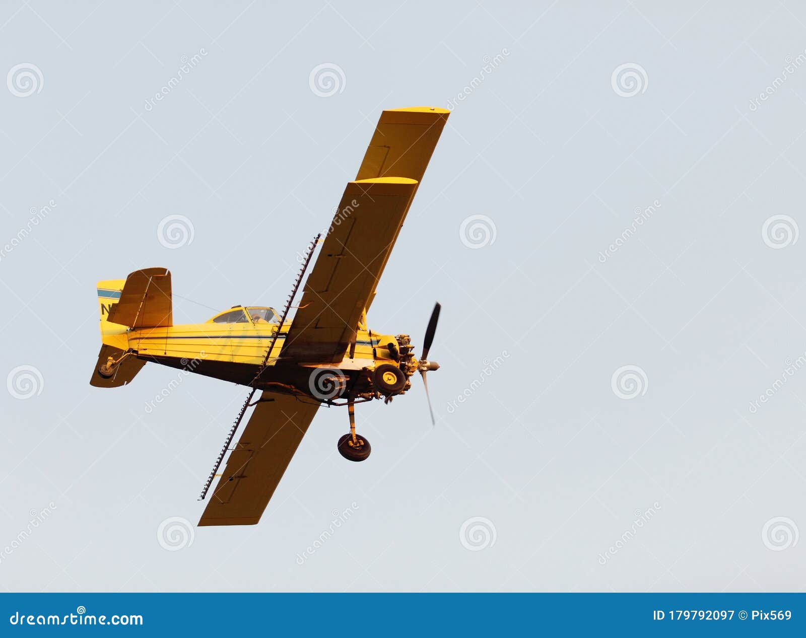 A Crop Duster Aircraft Against a Blue Sky. Stock Image - Image of ...