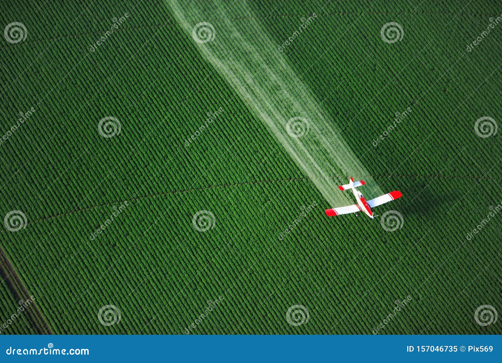 An Overhead View of a Crop Duster Spraying Green Farmland Stock Image ...