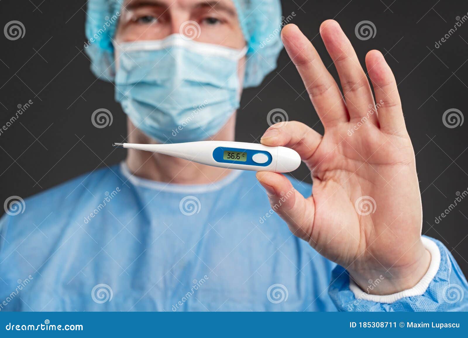 Male Doctor Showing Thermometer with Normal Temperature Stock Image ...