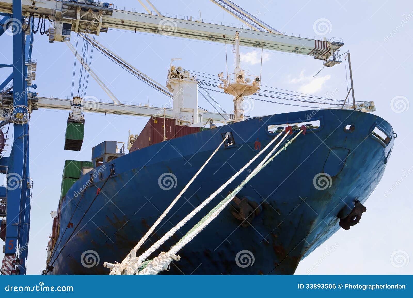 Cropped Cranes by Cargo Containers in Ship Stock Photo - Image of ...