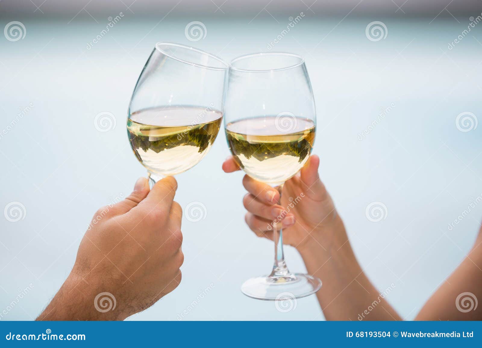 Cropped Hands of Couple Toasting White Wine Stock Photo - Image of ...
