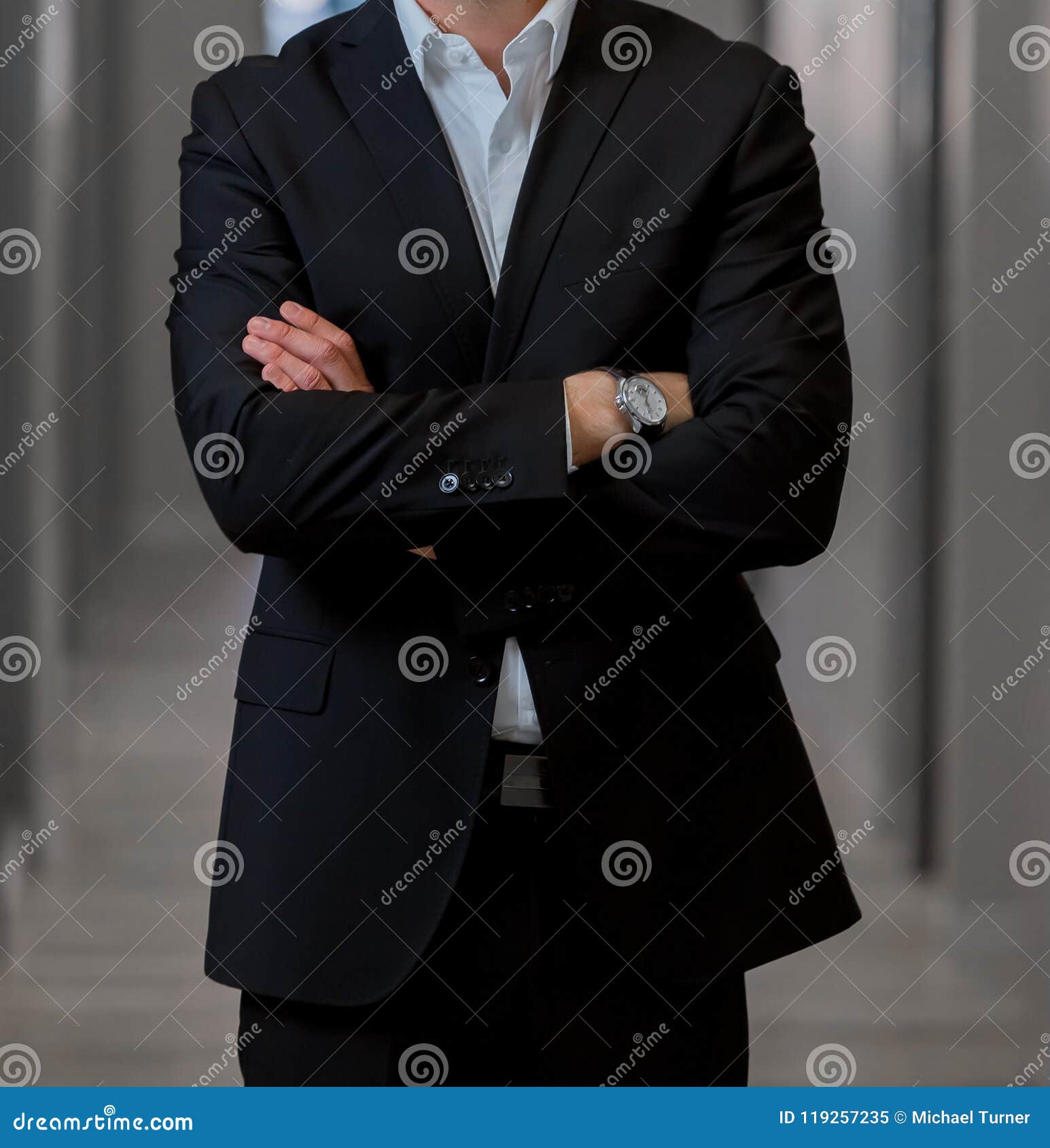 Cropped Head Man Standing in a Smart Suit with Folded Arms Editorial ... Cropped Head Man Standing in a Smart Suit with Folded Arms Editorial ...