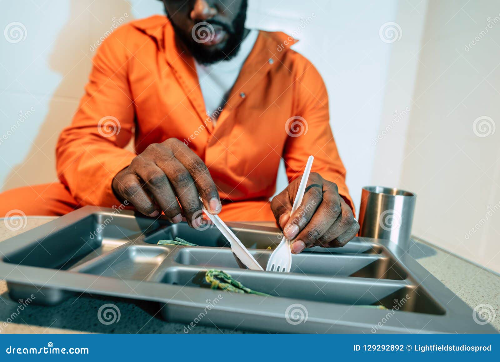 Cropped Image of African American Prisoner Eating Stock Photo - Image ...