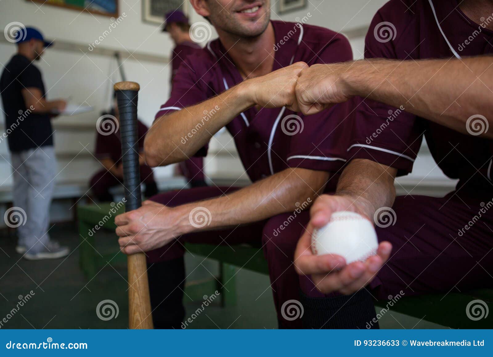 Cropped Image of Baseball Players Sitting on Bench Stock Image - Image ...