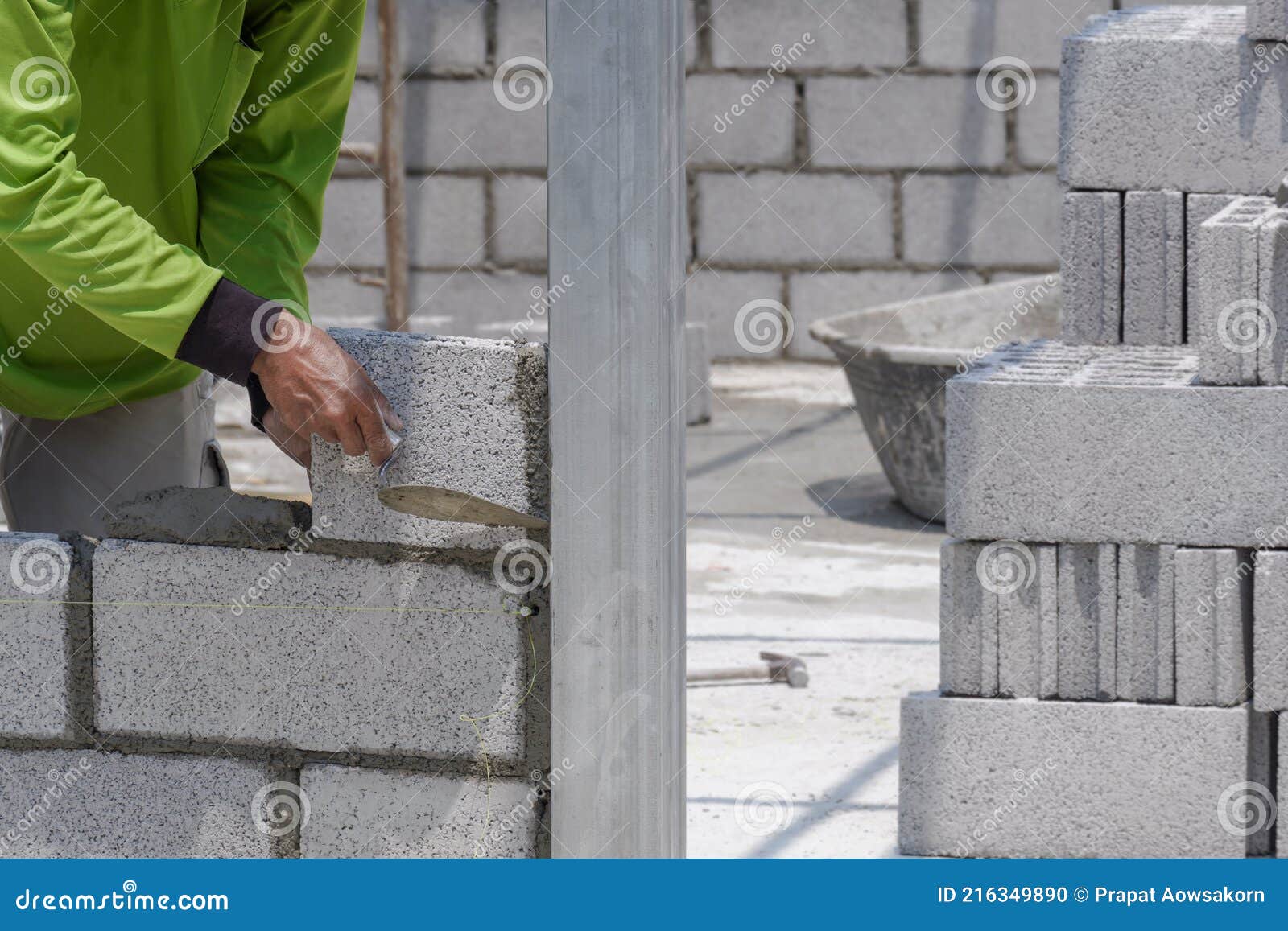 Bricklayer Making Interior Concrete Block Wall Inside of House ...
