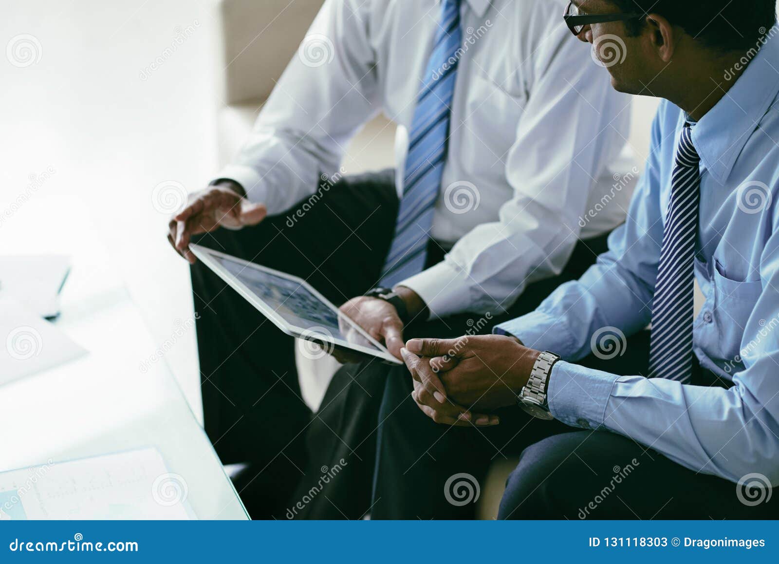 Coworkers discussing data stock image. Image of device - 131118303